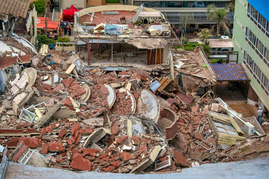 At least one dead and up to 11 missing after building collapse