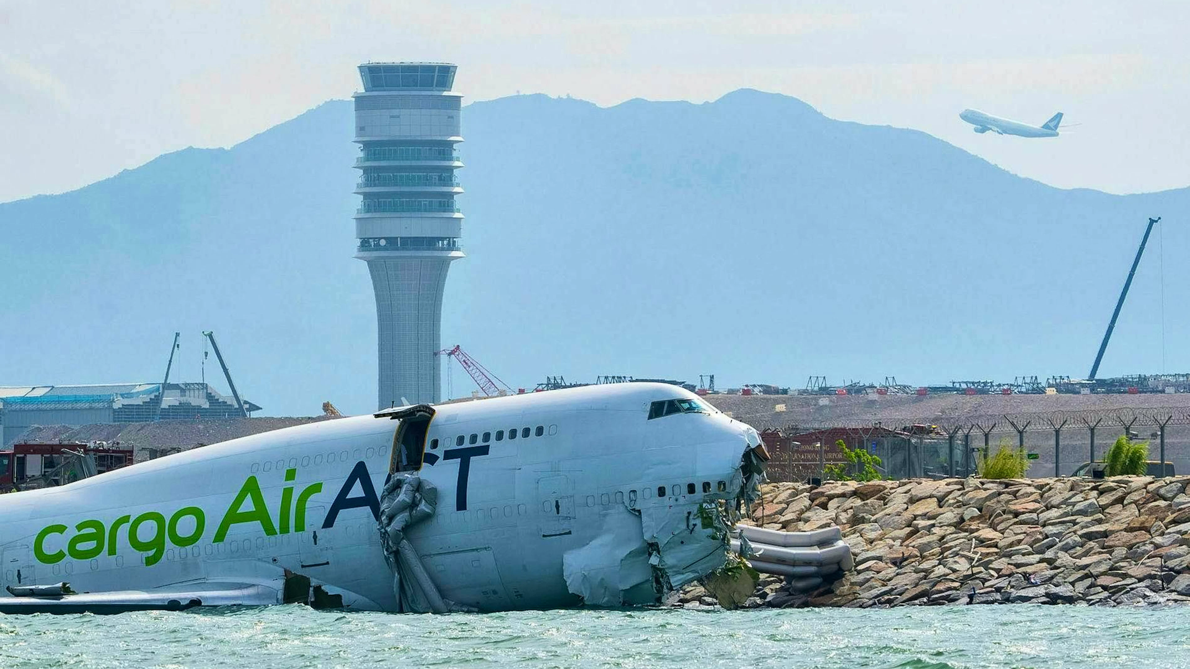 Jumbo jet skids over runway into the sea - two dead