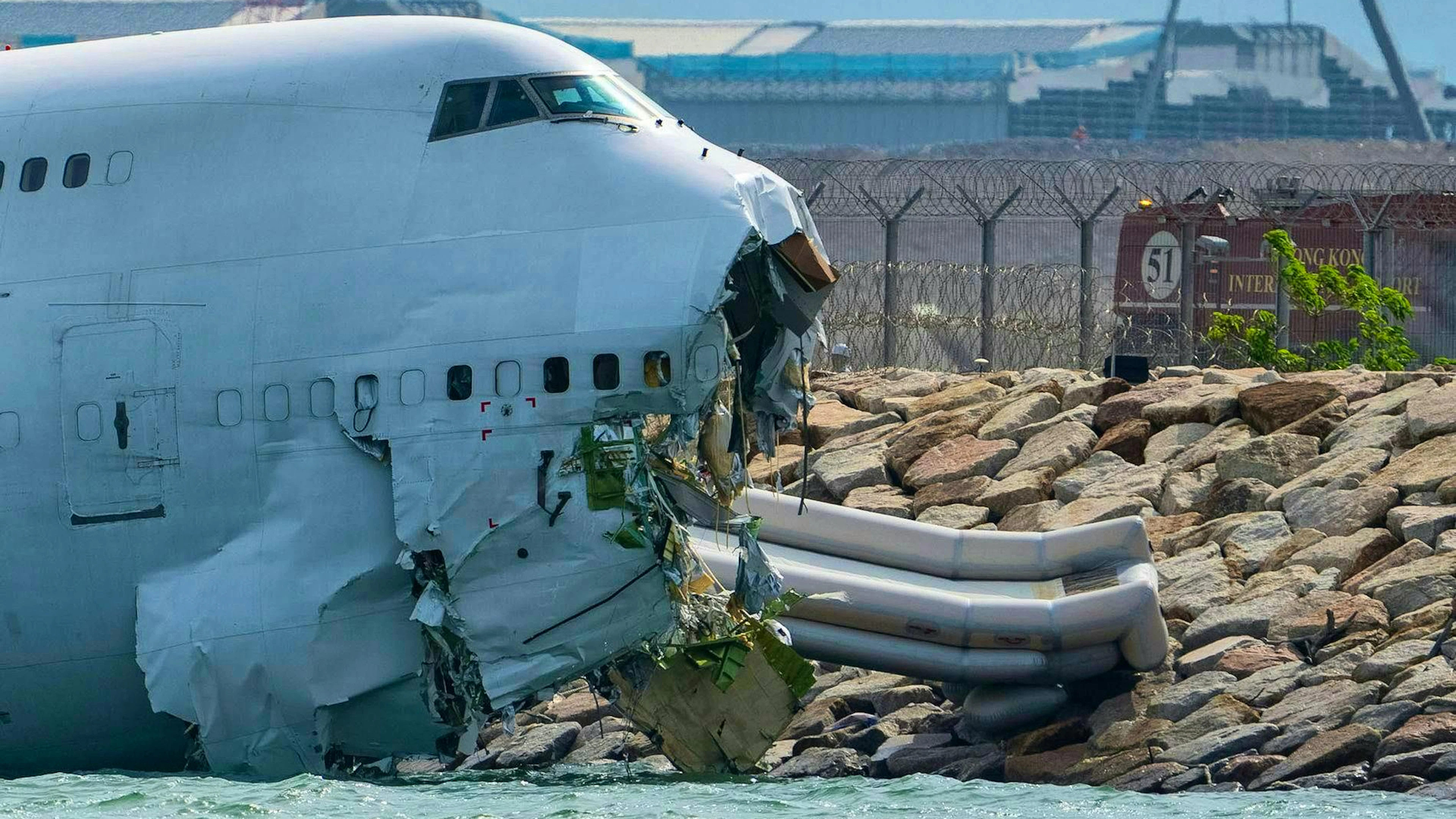 Jumbo jet skids over runway into the sea - two dead